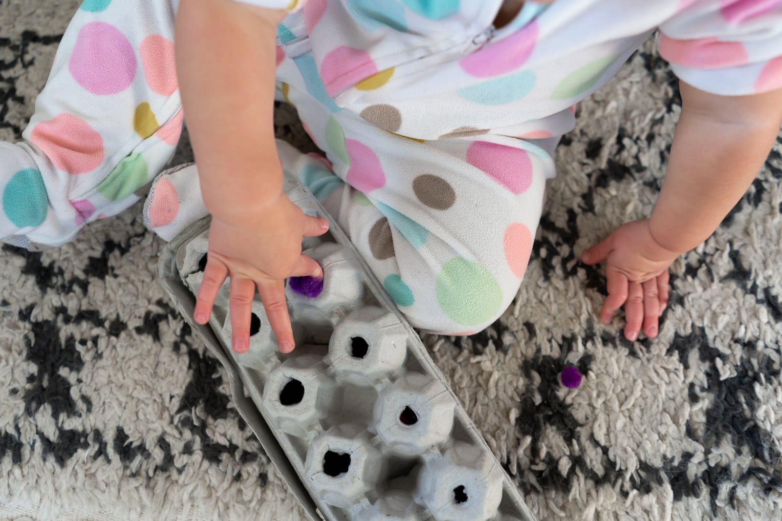 Pom Pom Push Fine Motor Activity to Keep Toddlers Busy