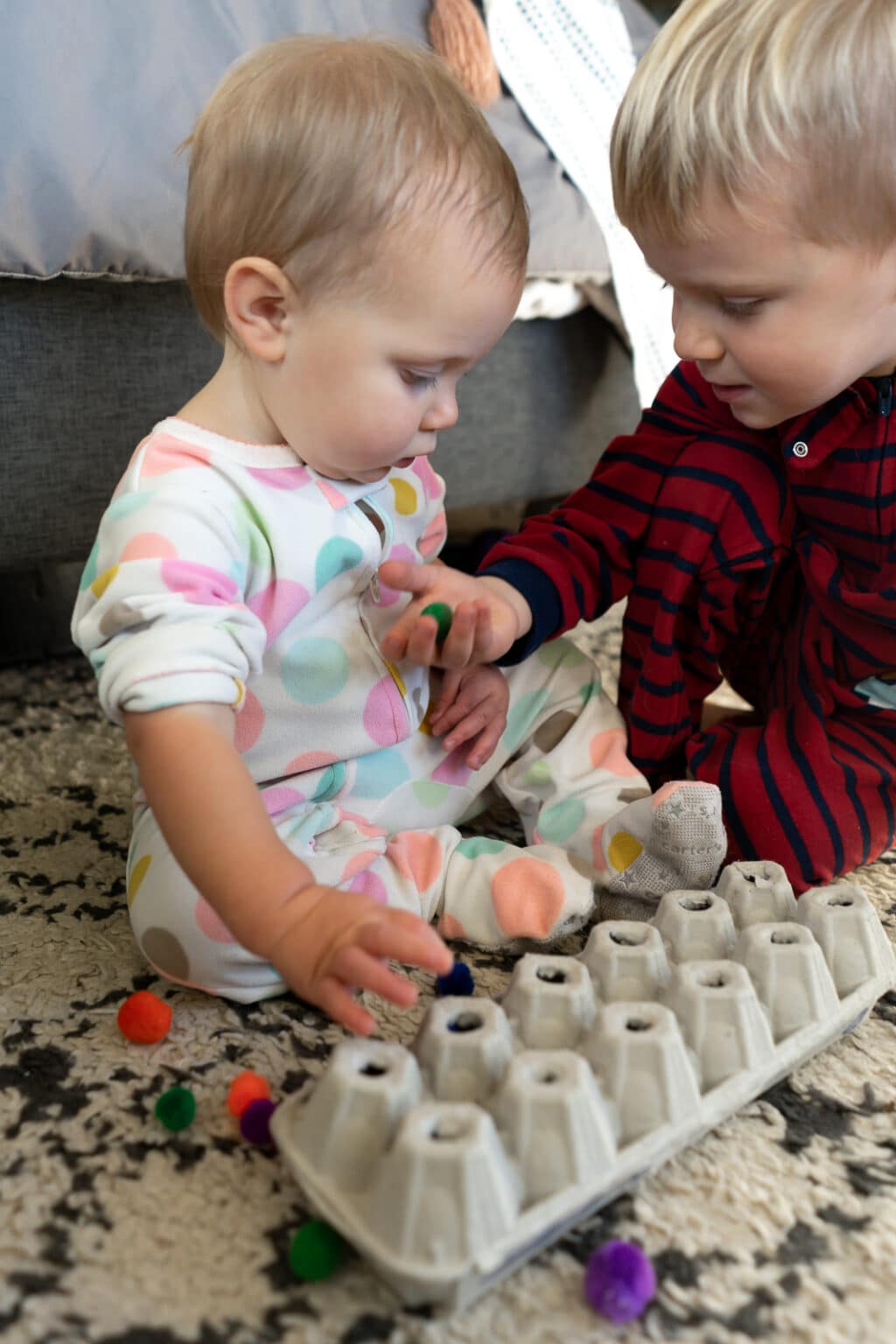 Pom Pom Push Fine Motor Activity to Keep Toddlers Busy