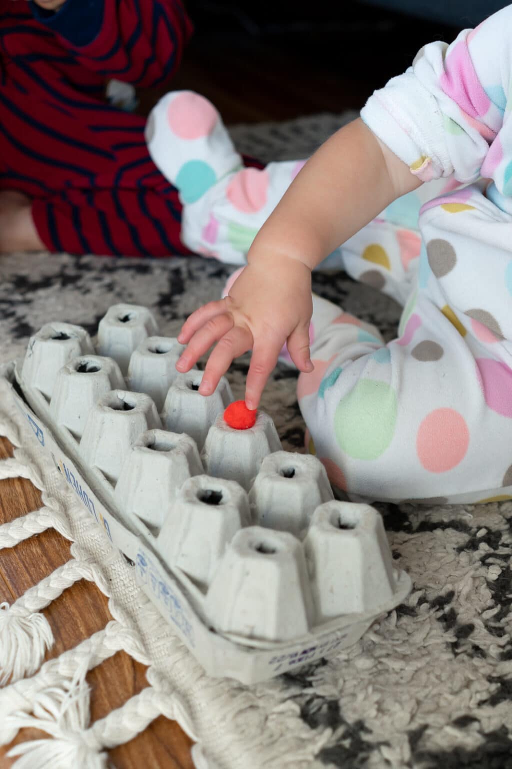 Pom Pom Push Fine Motor Activity to Keep Toddlers Busy