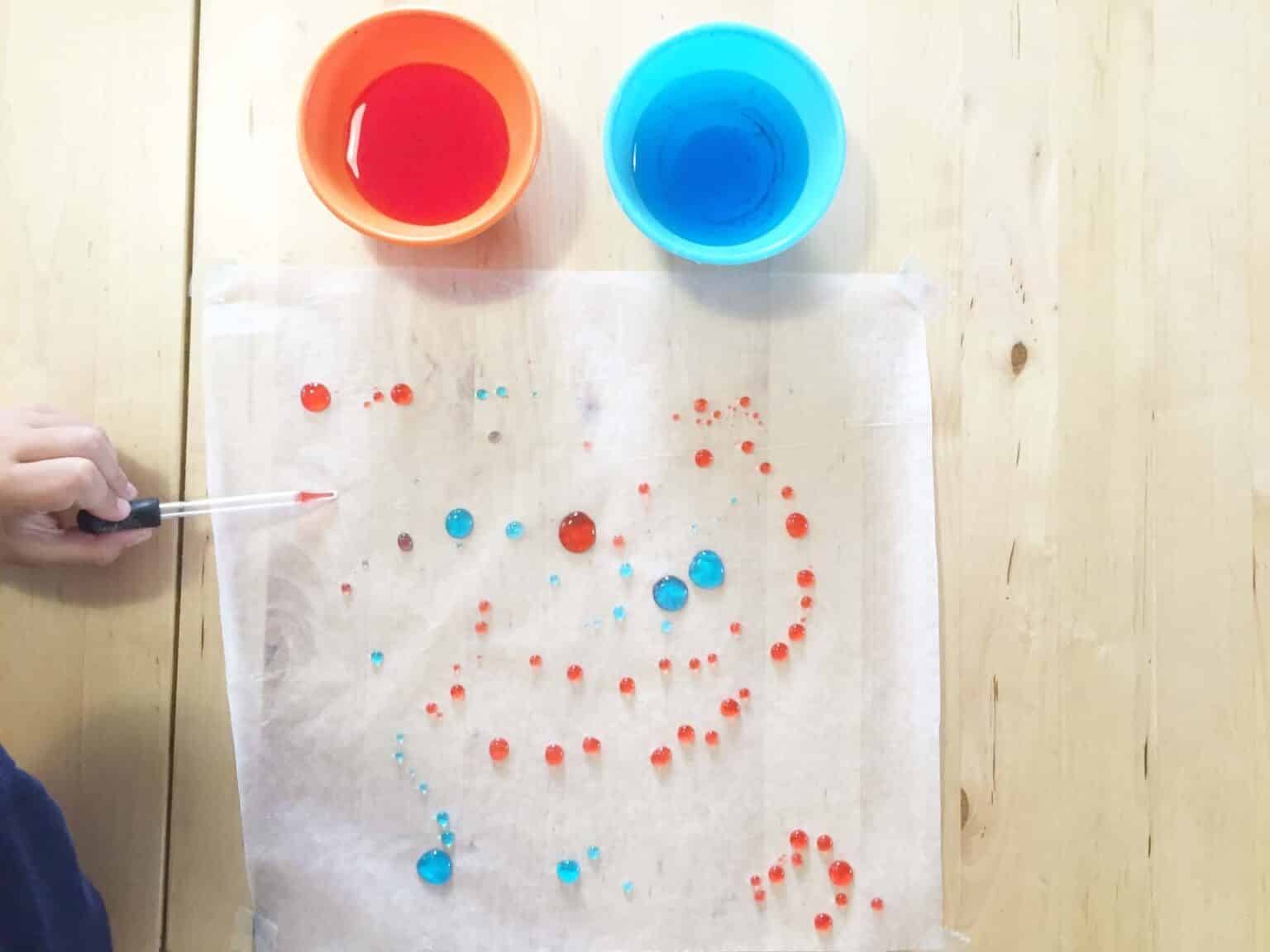 Color Mixing Water Drops on Wax Paper - Hands On As We Grow®